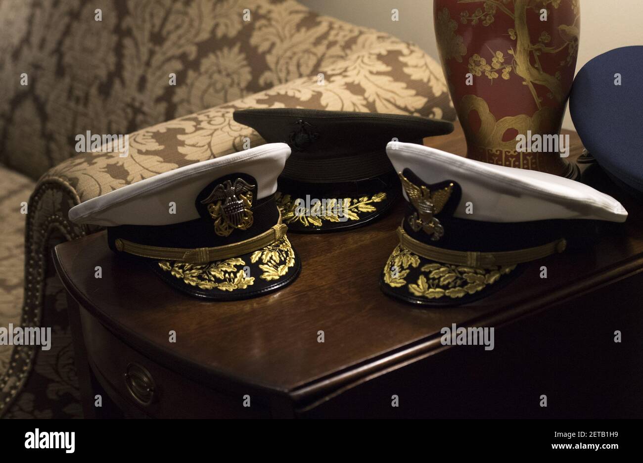 Military hats are seen outside of a meeting between President Barack ...