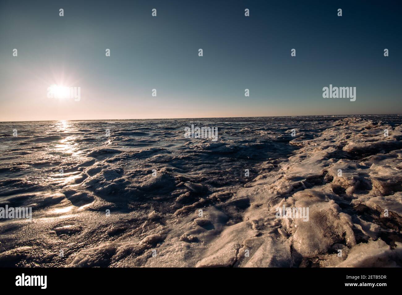 A beautiful shot of the coast and frozen North sea against the clear ...