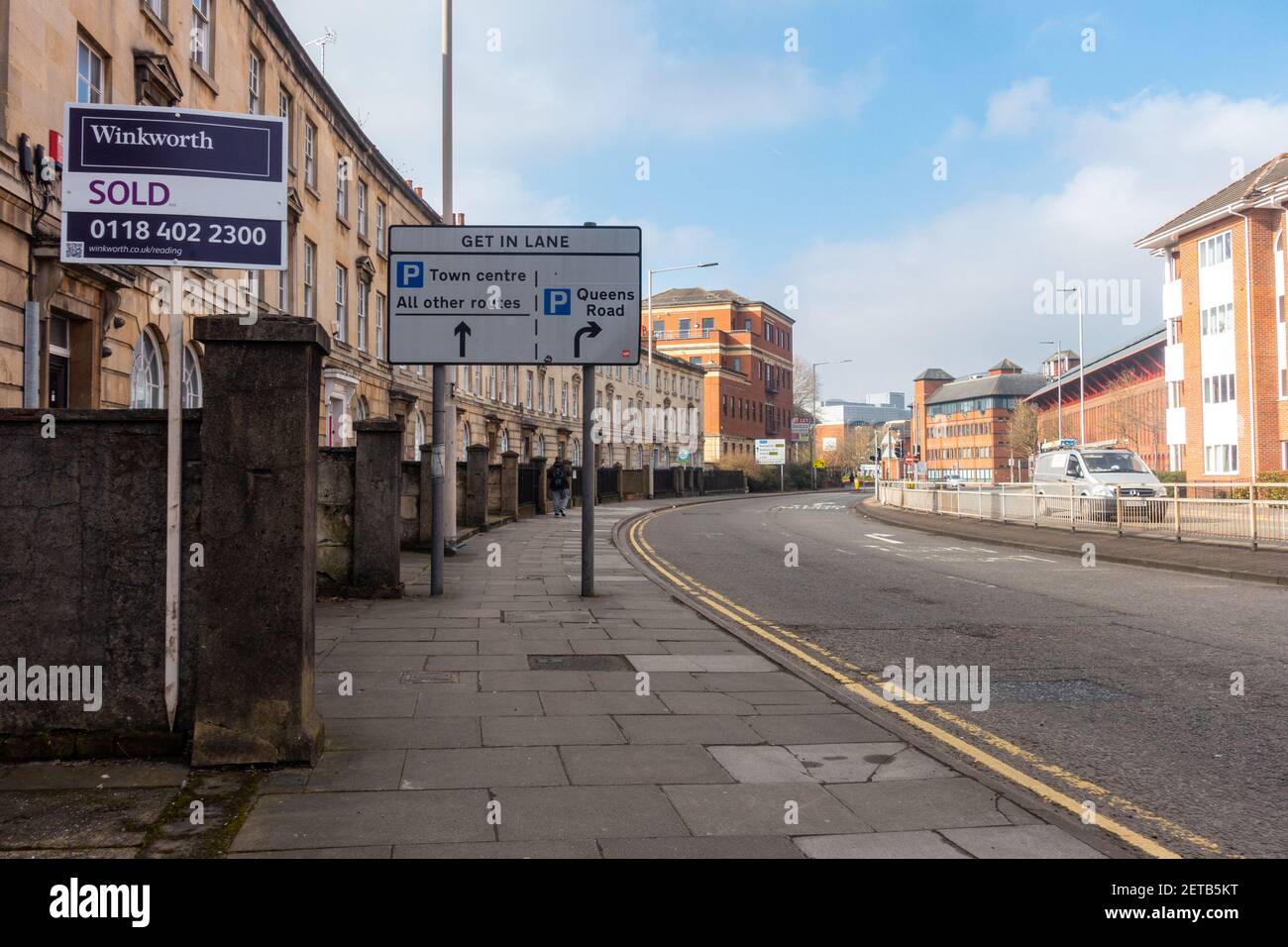 A view of curved terrace houses on Queen's Road in Reading, Berkshire ...