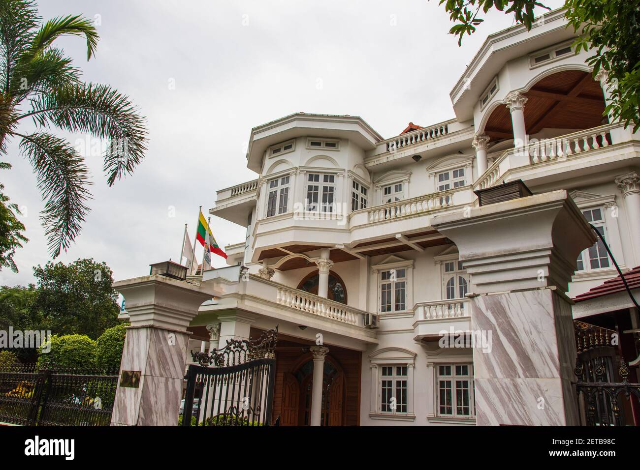 A colonial-style house under a cloudy sky in Yangon, Myanmar, Burma Stock Photo - Alamy