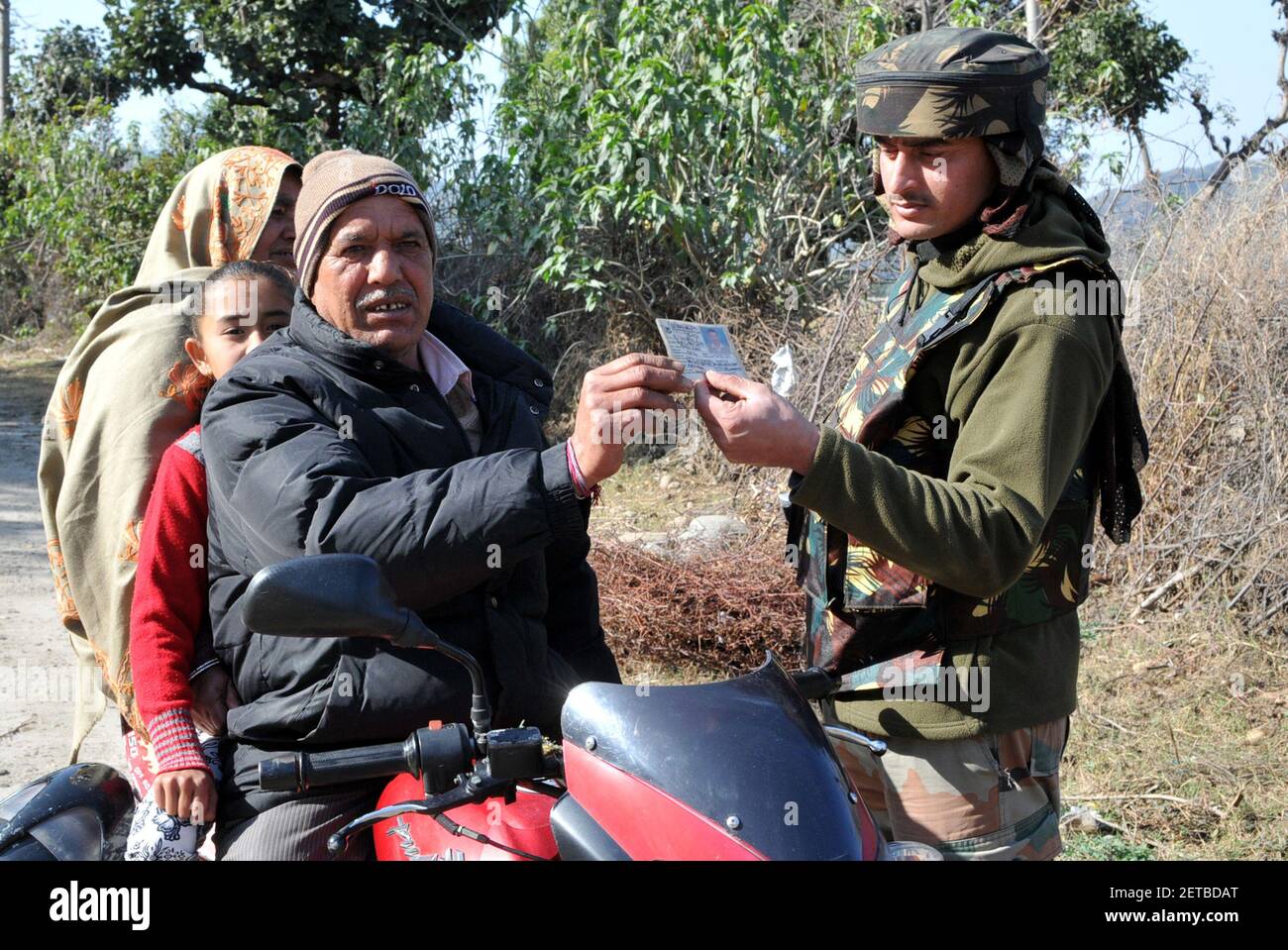 JAMMU, INDIA - JANUARY 9: A civilian showing his ID card during a ...