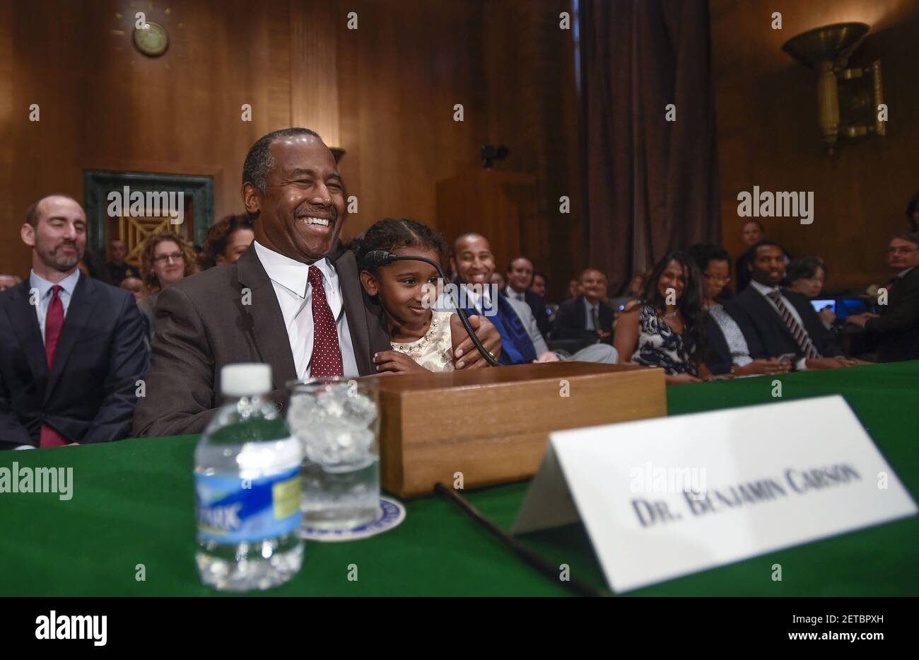 Ben Carson greets his granddaughter Tesora Carson prior to testifying ...