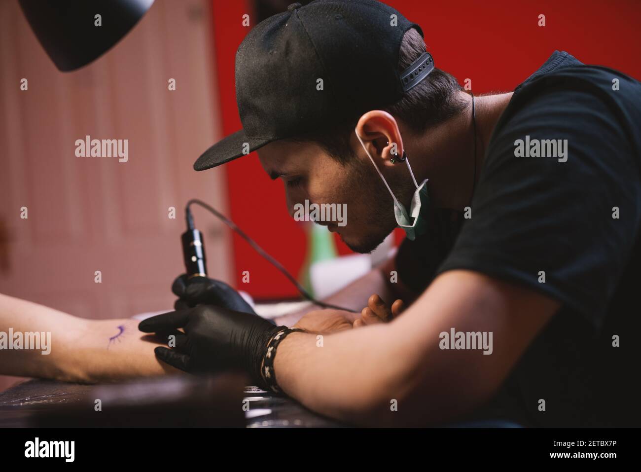 Careful tattooing hi-res stock photography and images - Alamy
