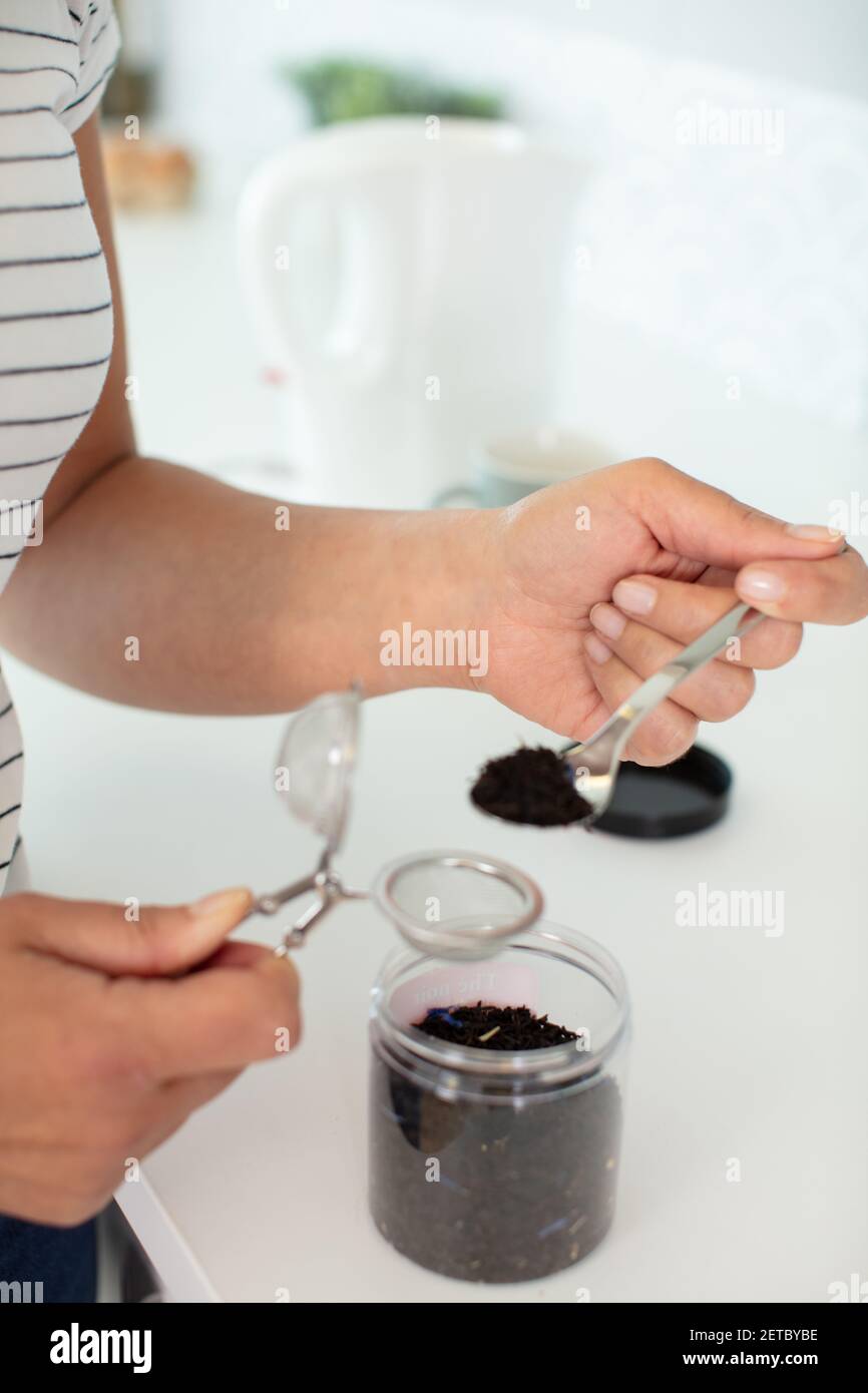 Man making tea close hi-res stock photography and images - Alamy