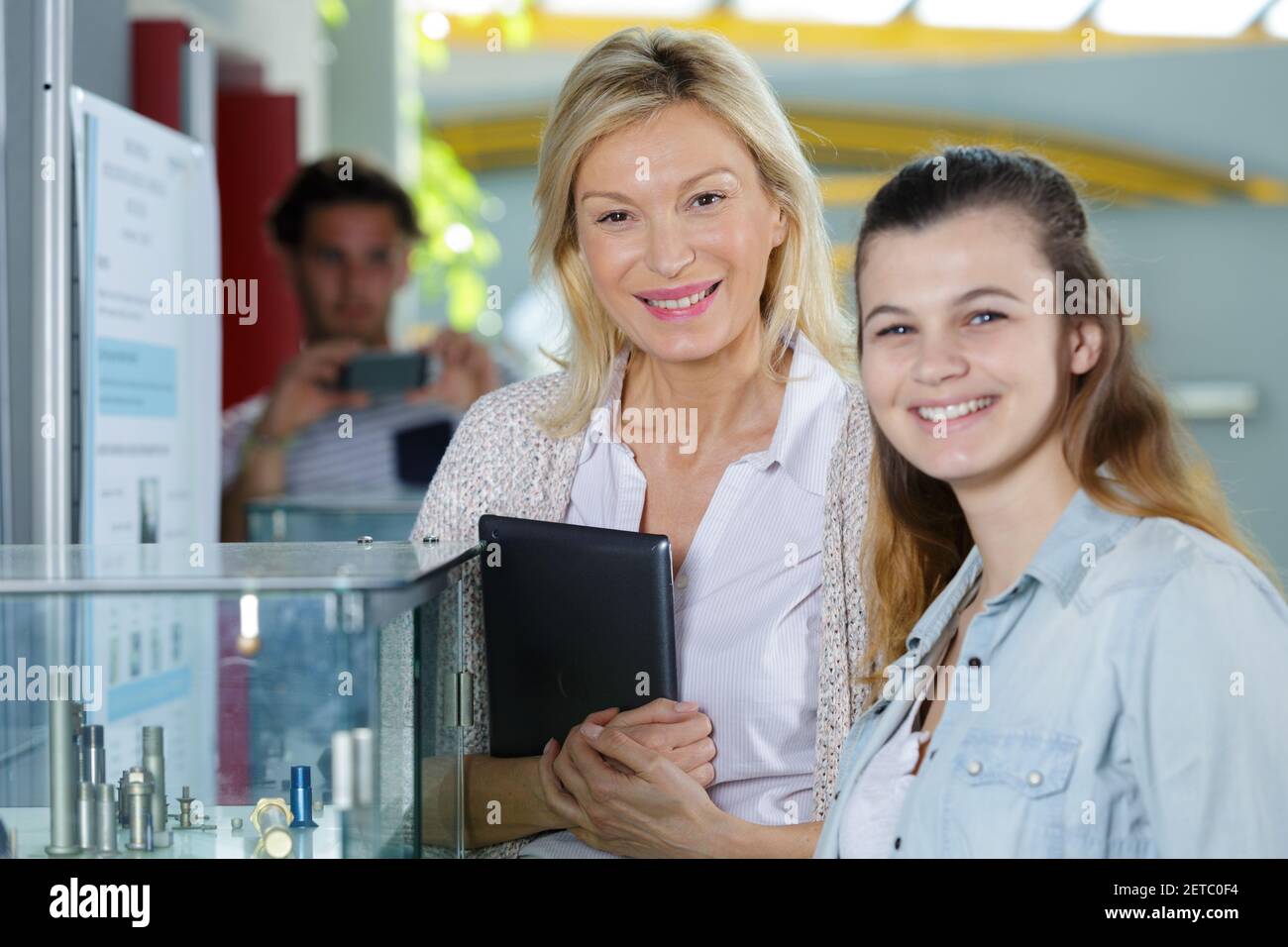 teacher and student using microscope Stock Photo - Alamy