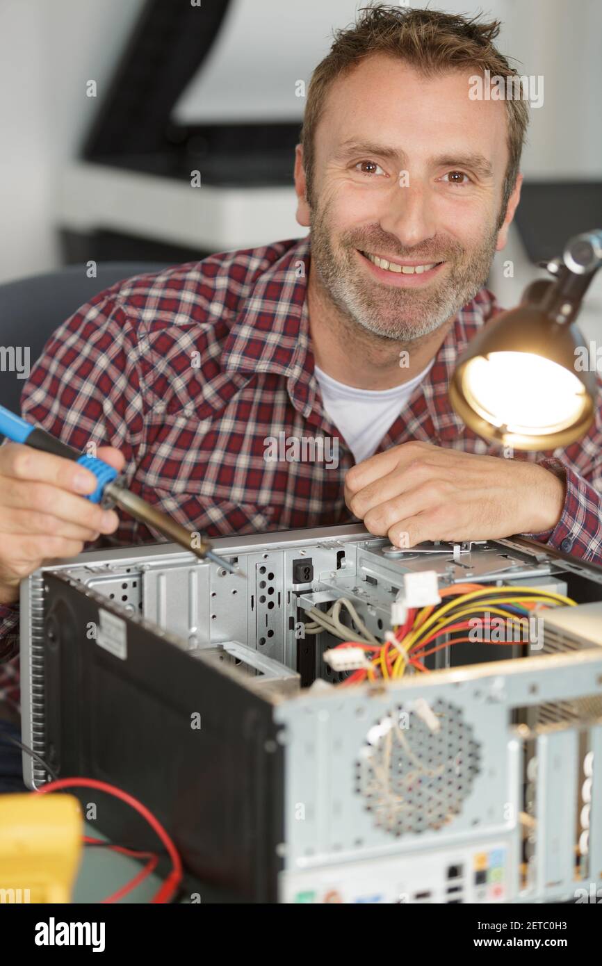 Computer fixes hi-res stock photography and images - Alamy