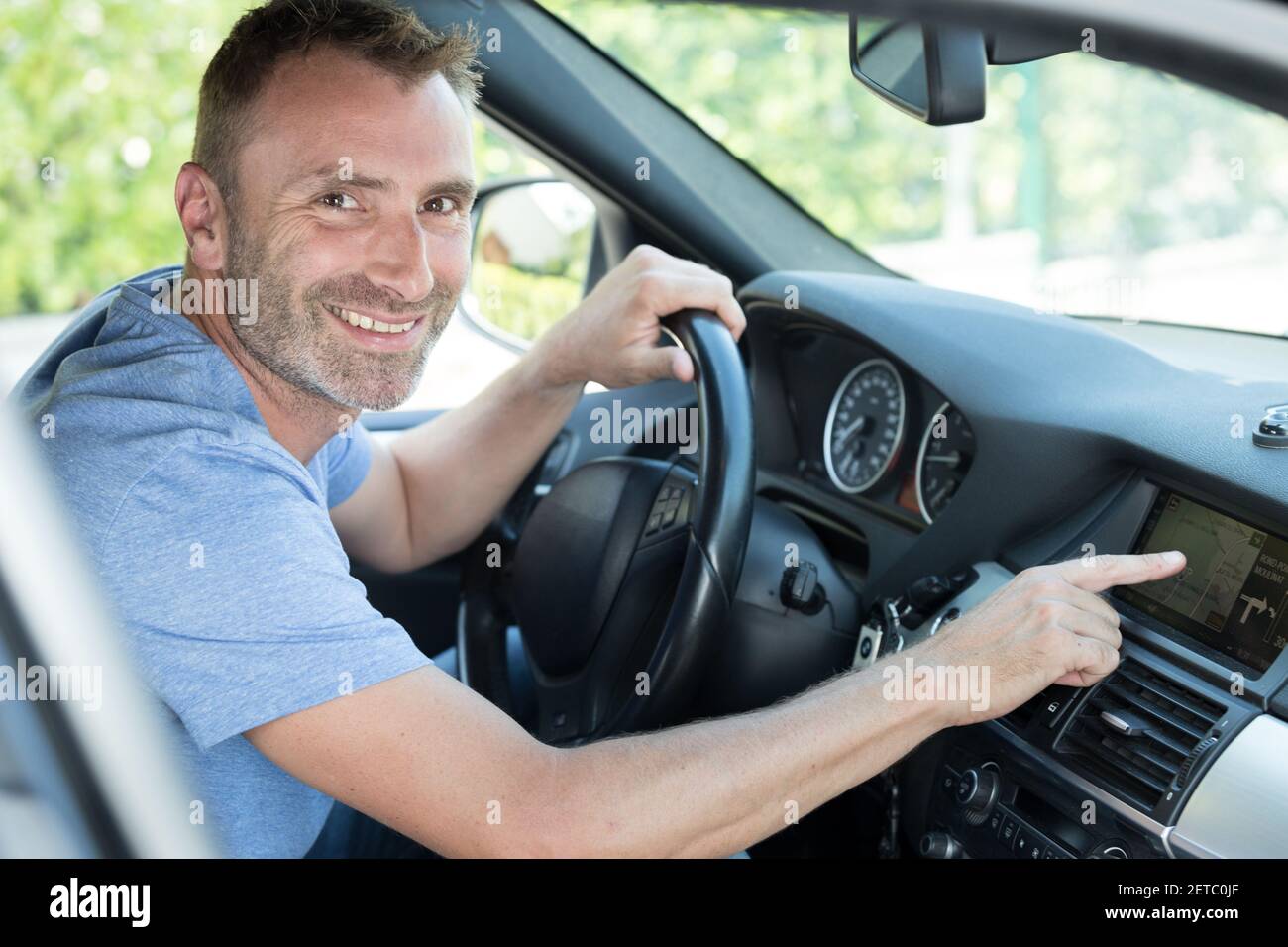man using gps navigation system in car Stock Photo - Alamy
