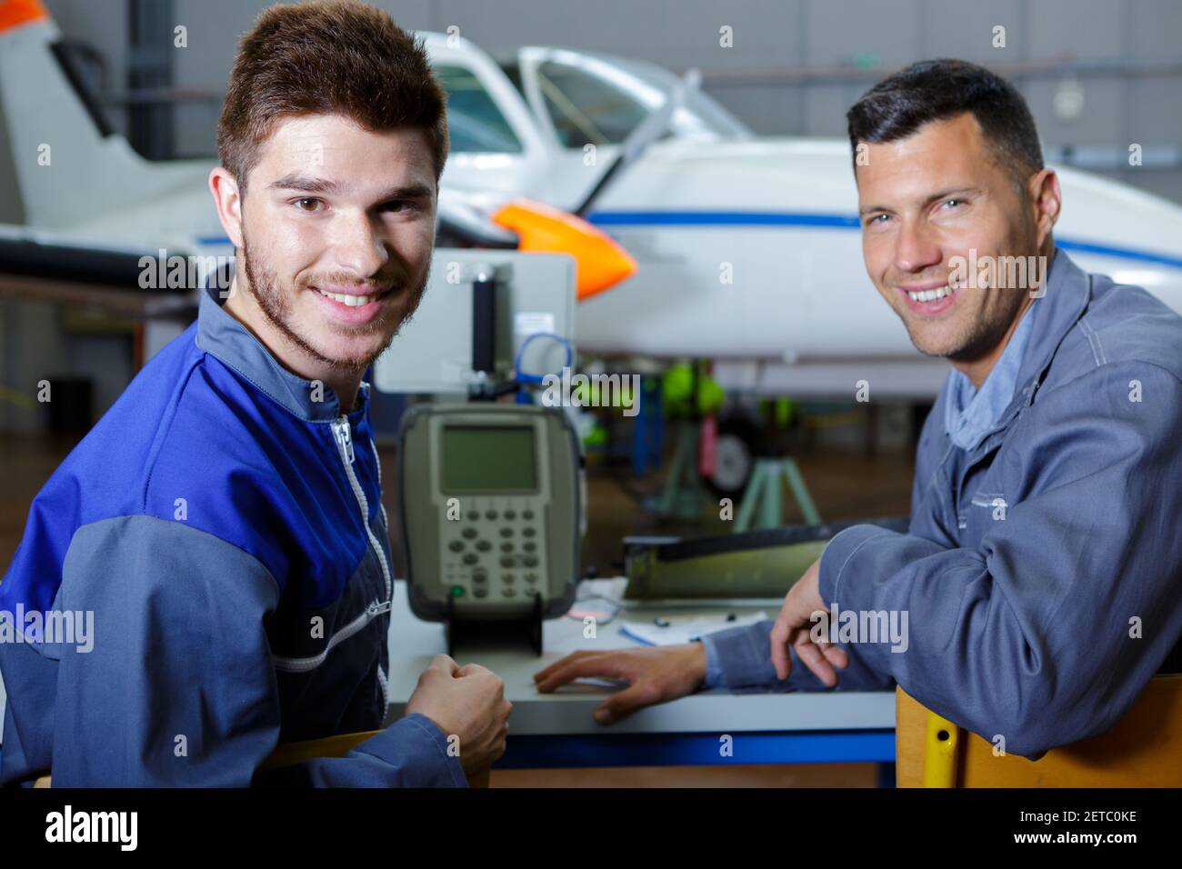 Aviation mechanic working on airplane hi-res stock photography and ...
