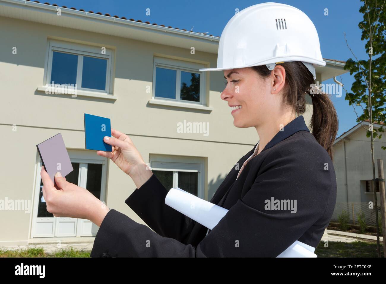 woman choosing the perfect paint color for building Stock Photo - Alamy