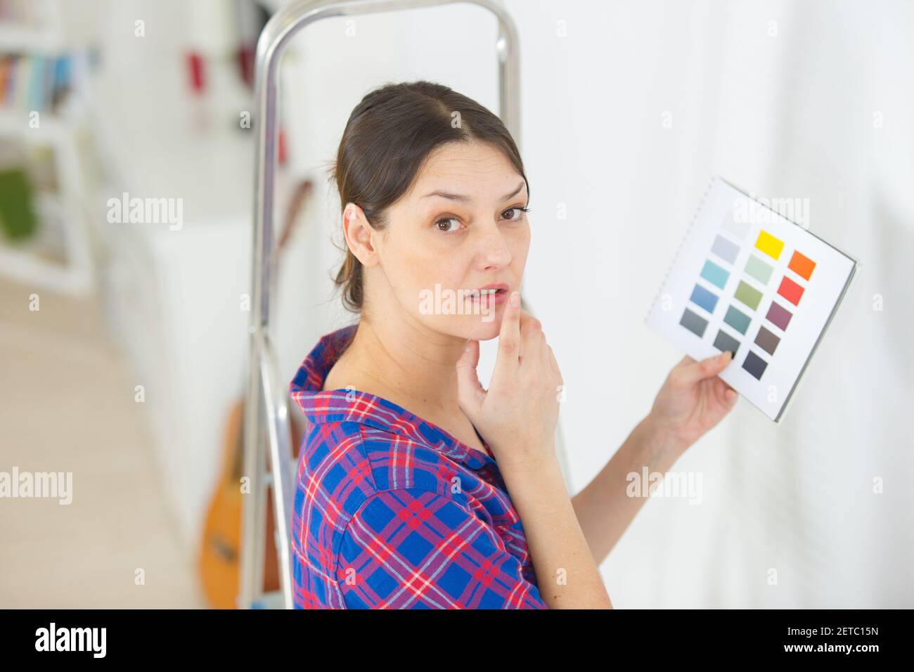 young designer choosing from color swatches Stock Photo - Alamy