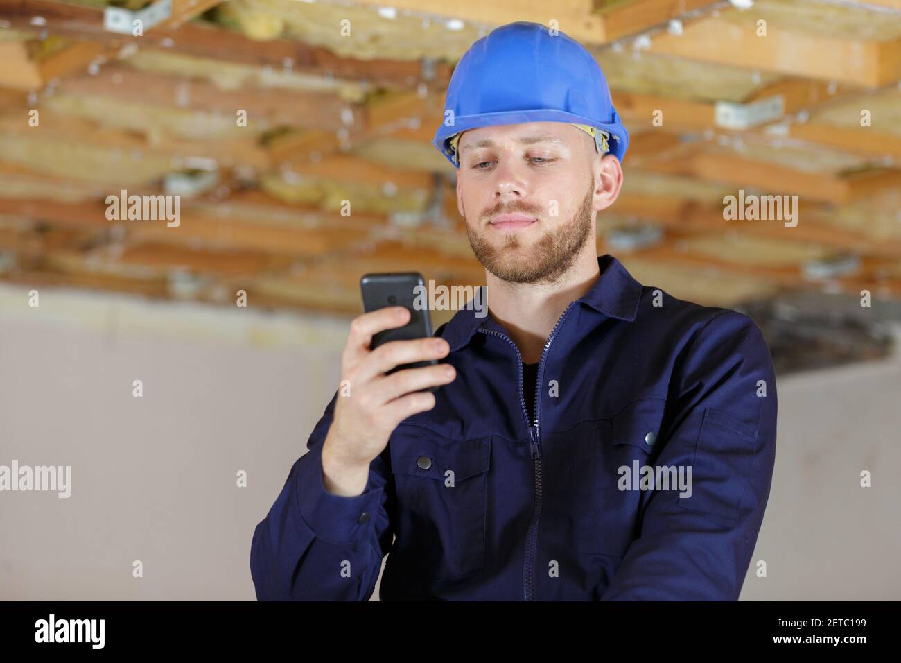 Portrait builder checking wall hi-res stock photography and images - Alamy