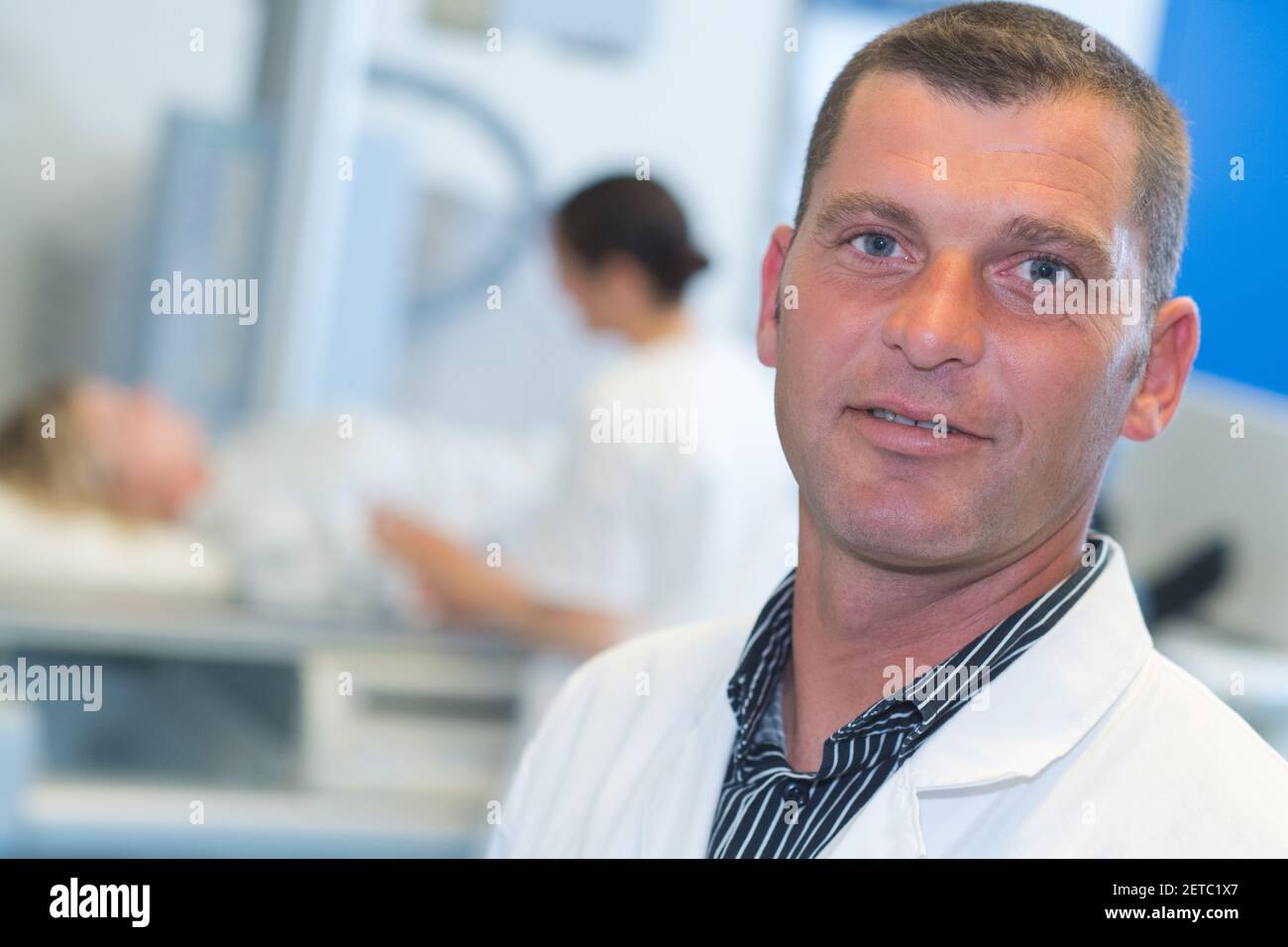 portrait of happy doctor smiling in conference room Stock Photo - Alamy