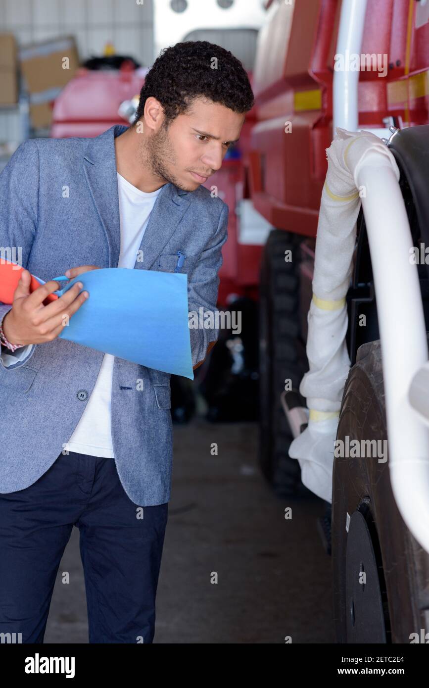 a professional mechanic behind work Stock Photo - Alamy