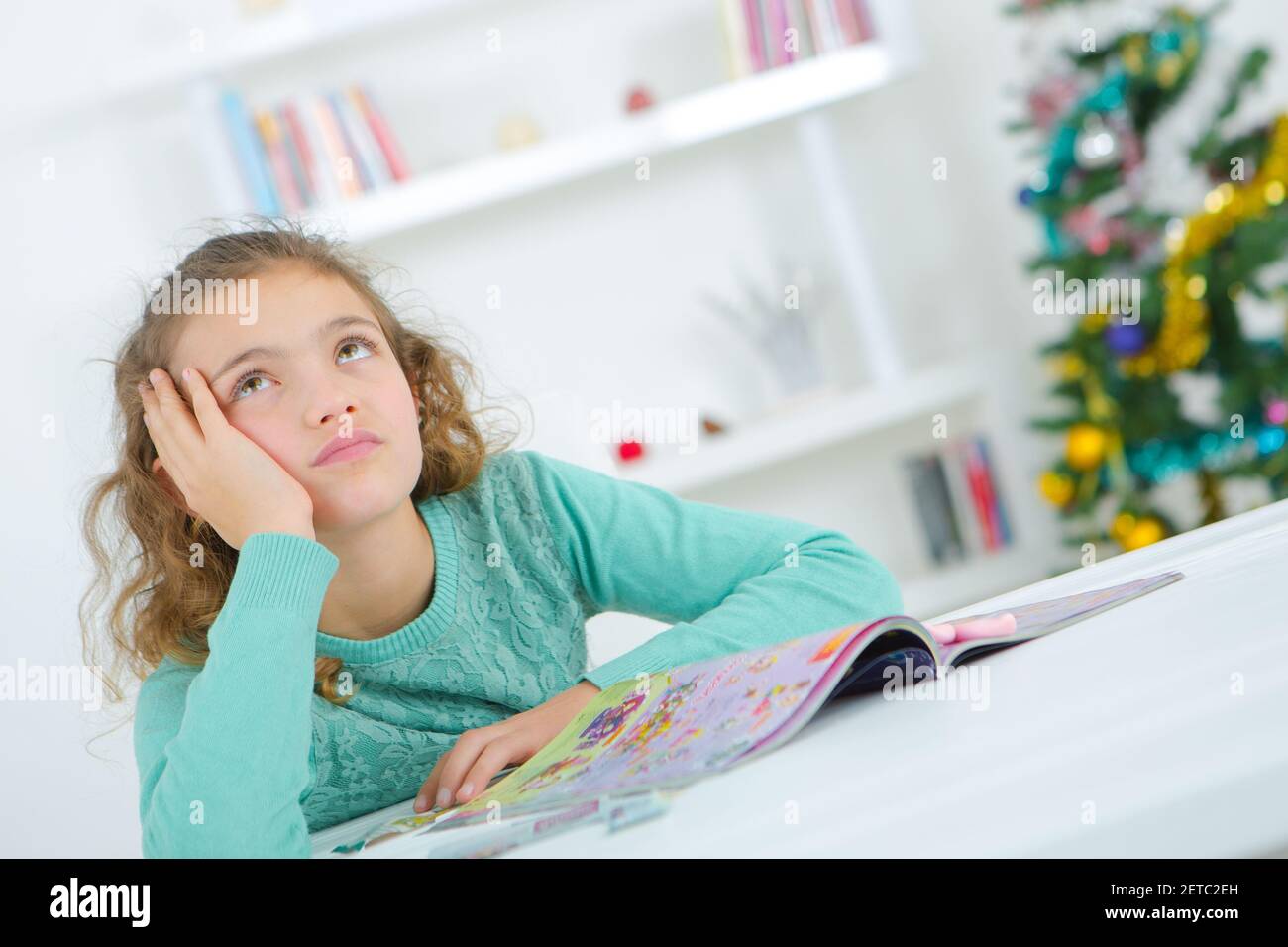 a young girl is daydreaming Stock Photo - Alamy