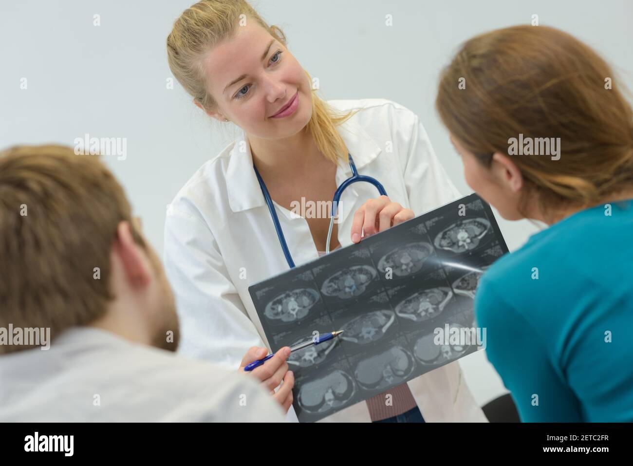 doctor showing scan results to patient Stock Photo - Alamy