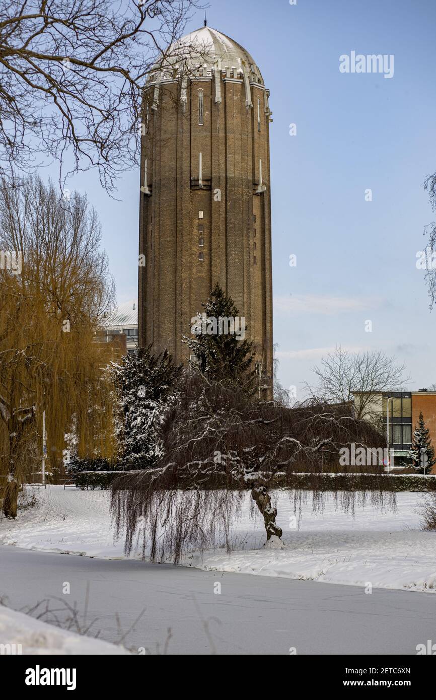 Historic former water tower now a residential building at the frozen ...