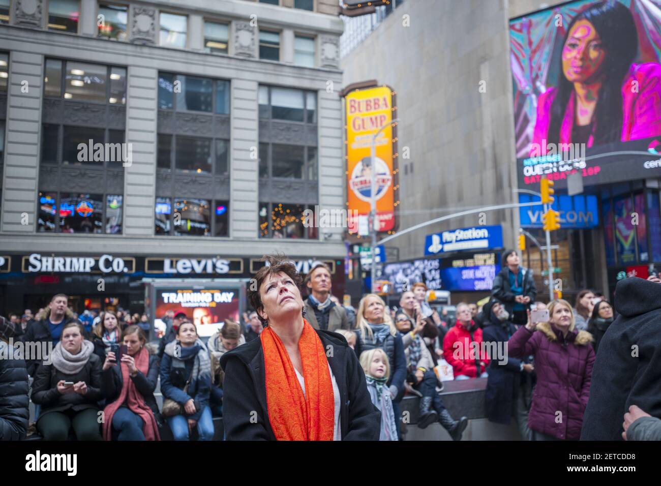 Visitors to Times Square in New York view the inauguration of Donald ...