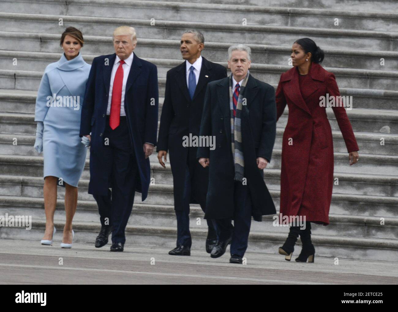President Donald Trump and former president Barack Obama walk to the ...