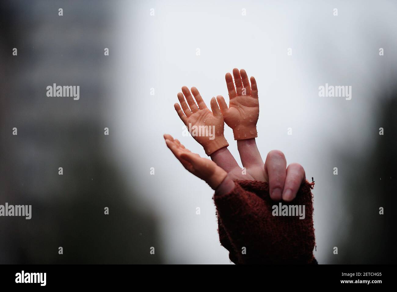 A woman wears tiny hands on her fingers during the Women's March On ...