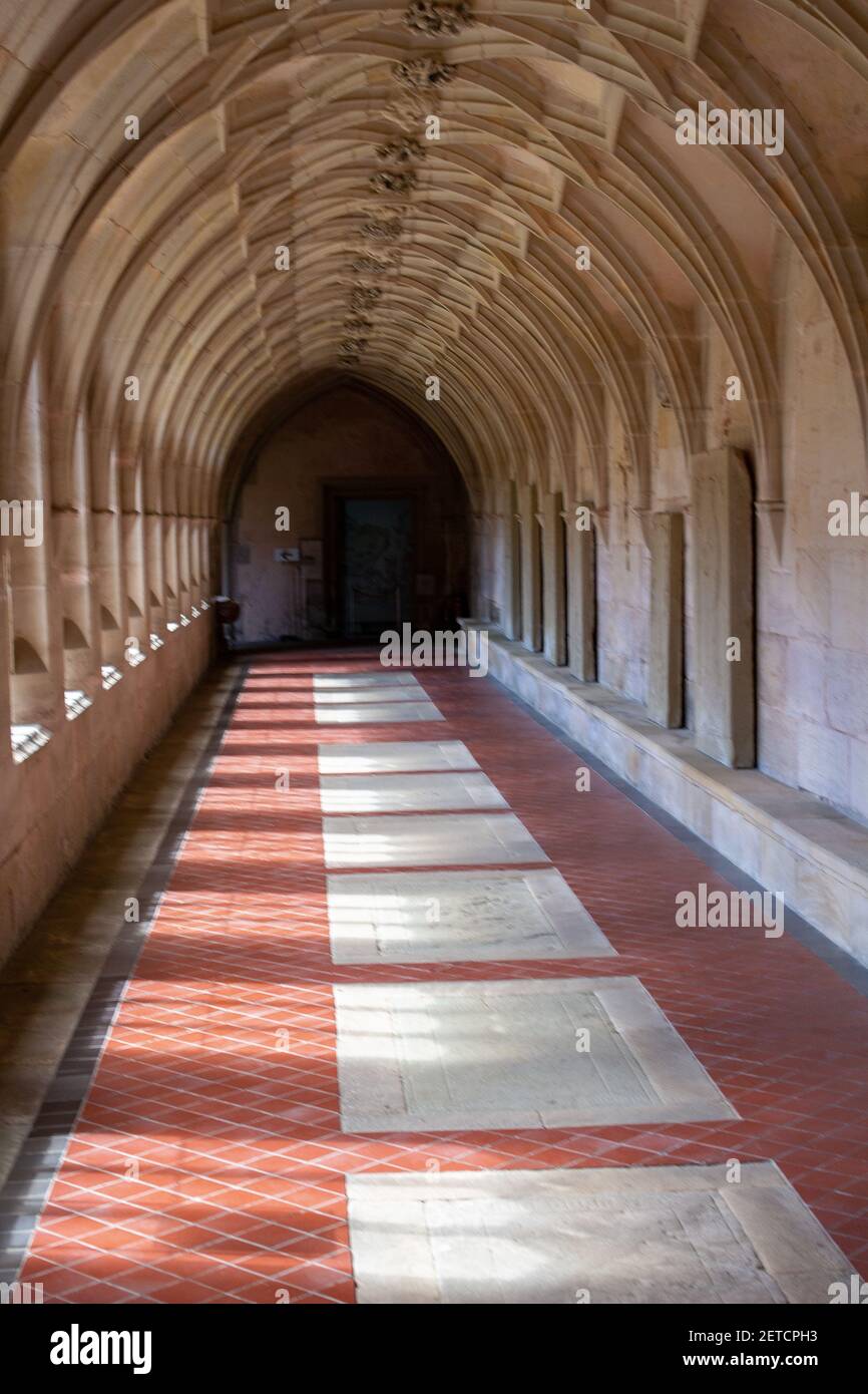 A vertical shot of an old architectural building interior with stone ...