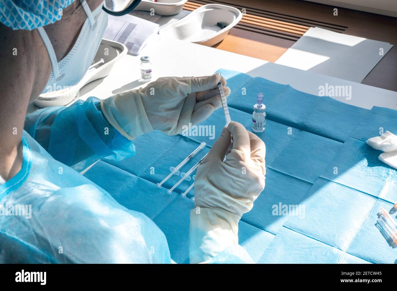Medical worker prepare an injection of vaccine during a massive ...