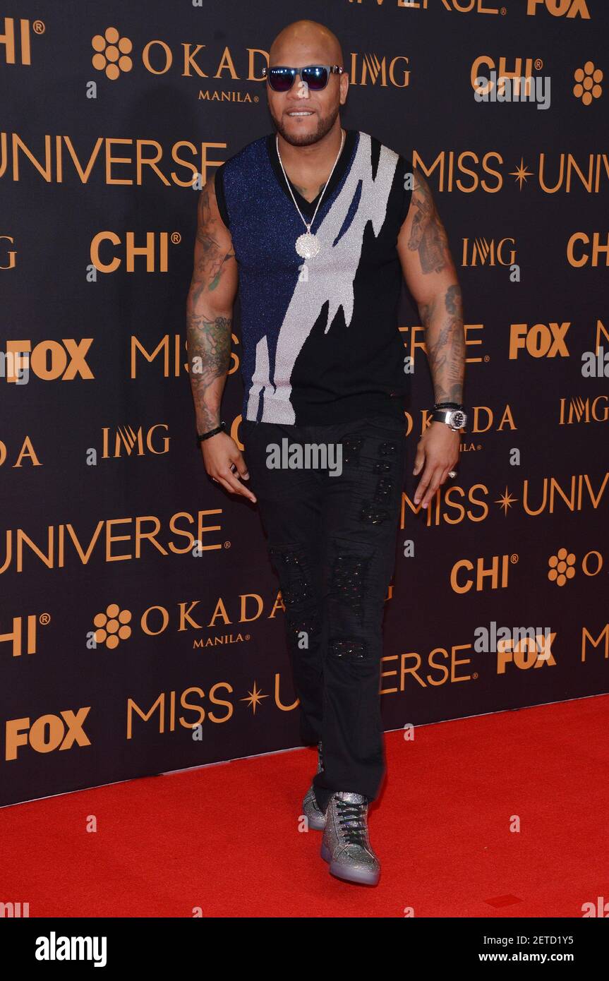 Flo Rida arrives at the 65th Miss Universe Red Carpet held at the SMX ...