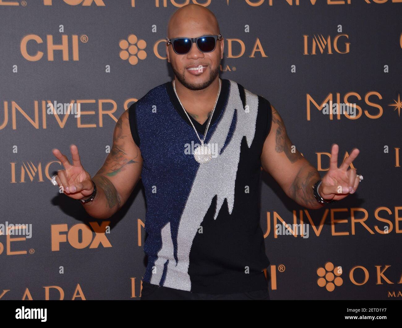 Flo Rida arrives at the 65th Miss Universe Red Carpet held at the SMX ...