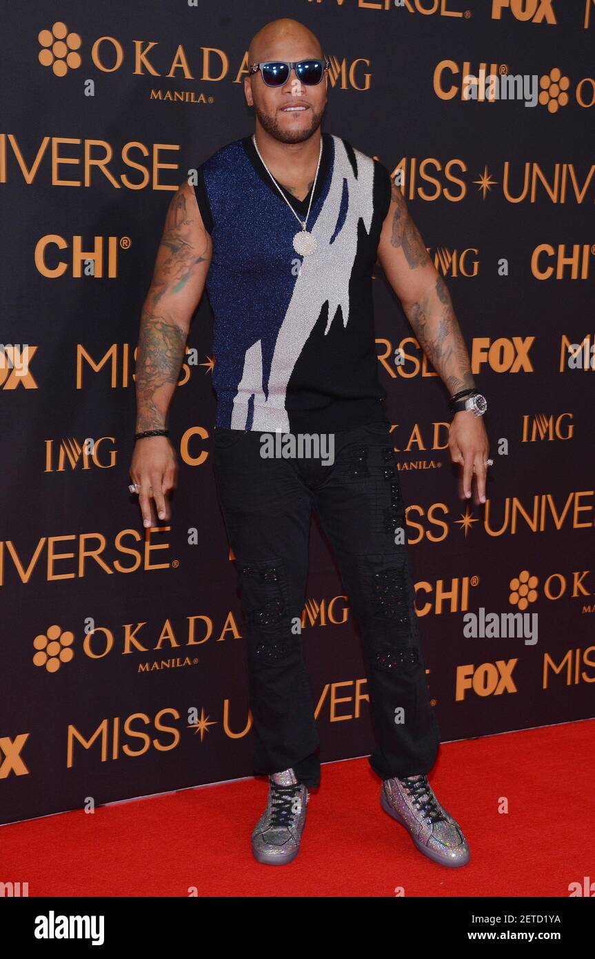 Flo Rida arrives at the 65th Miss Universe Red Carpet held at the SMX ...