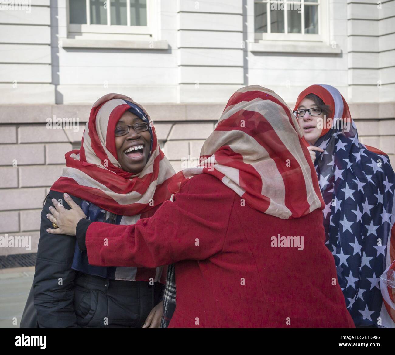 Non-Muslim women are assisted in wearing a Hijab during World Hijab Day ...
