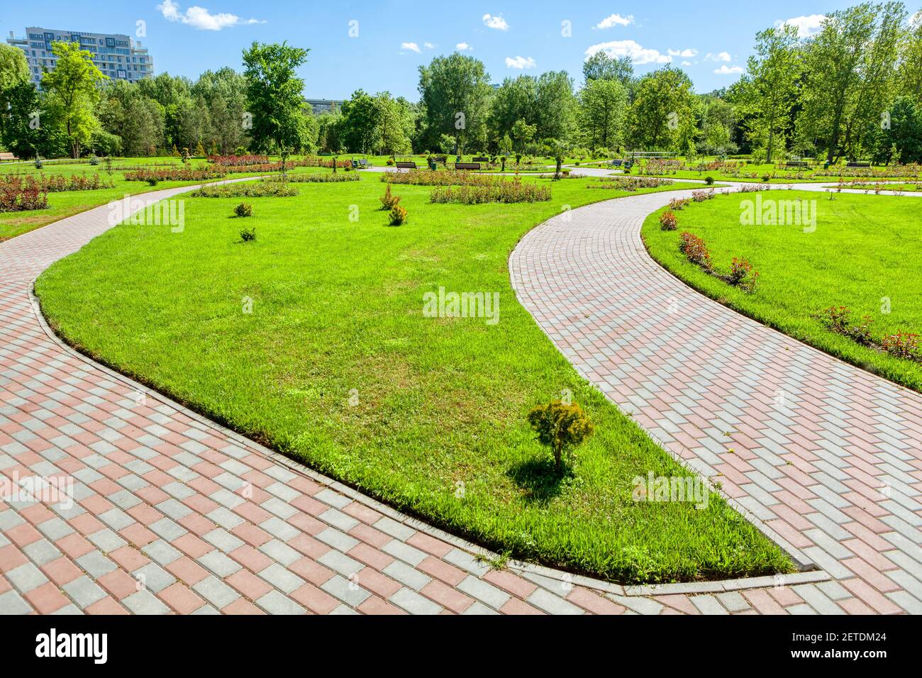 Pedestrian walking paths in the spring park Stock Photo - Alamy