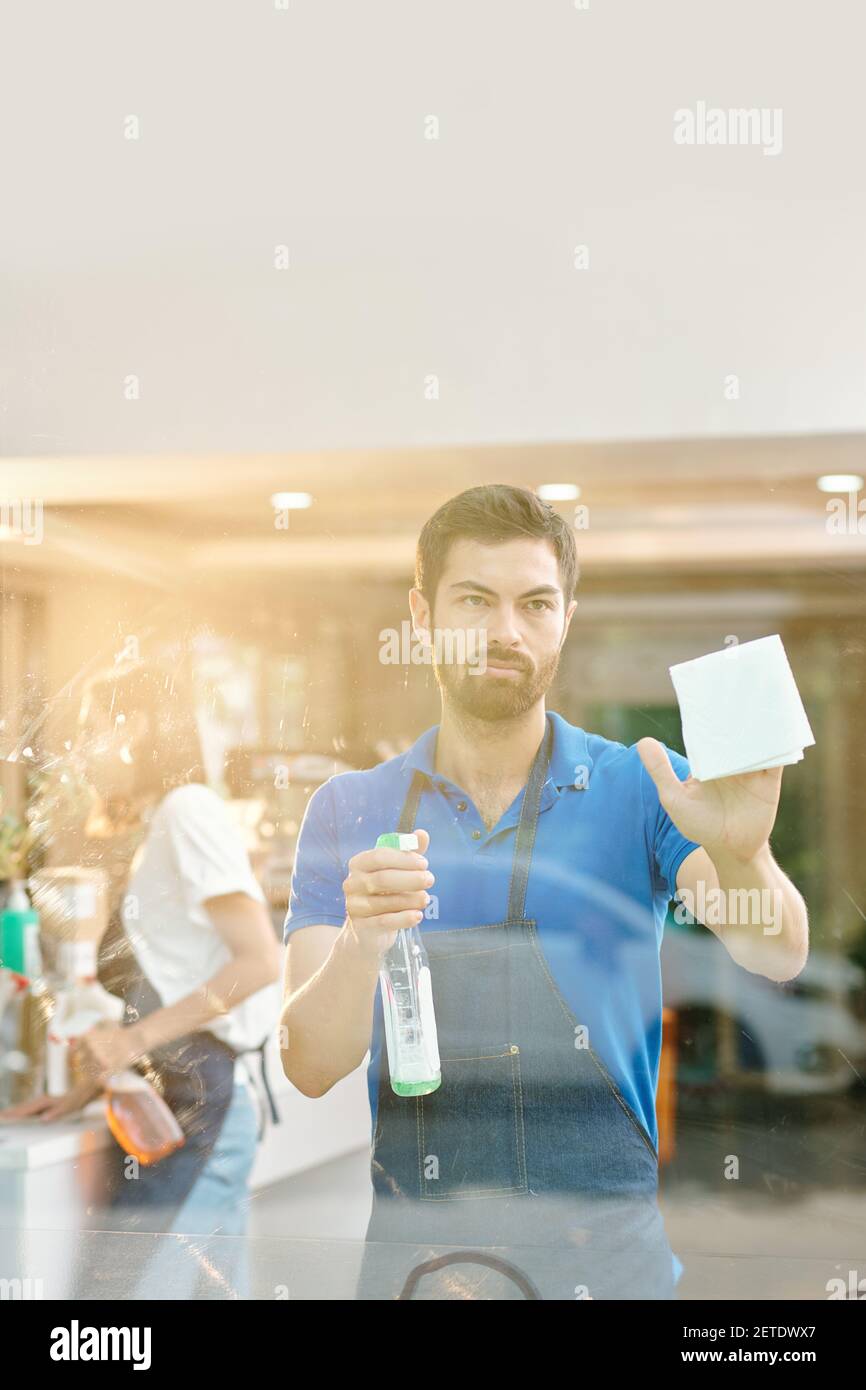 Water cleaning cafe windows Stock Photo - Alamy