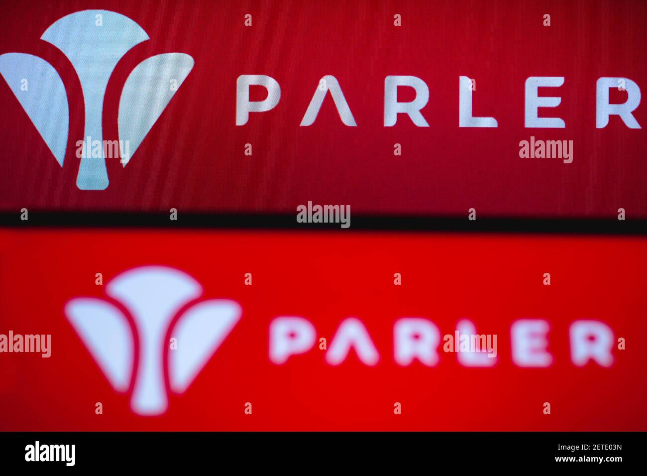 In this photo illustration the Parler logo seen displayed on a ...