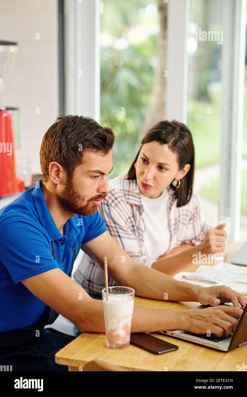 Discussing business development Stock Photo - Alamy