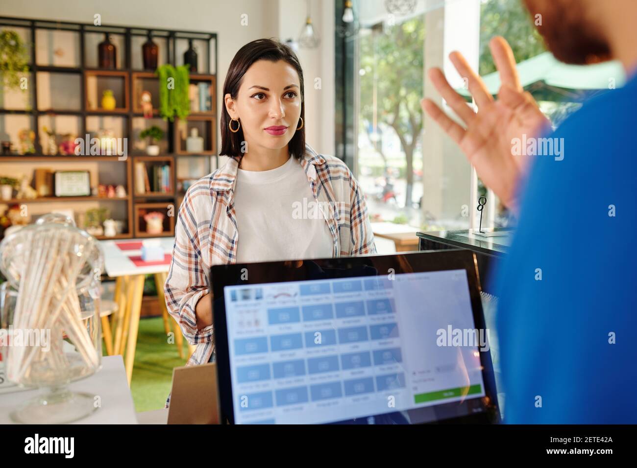 Customer making order Stock Photo - Alamy