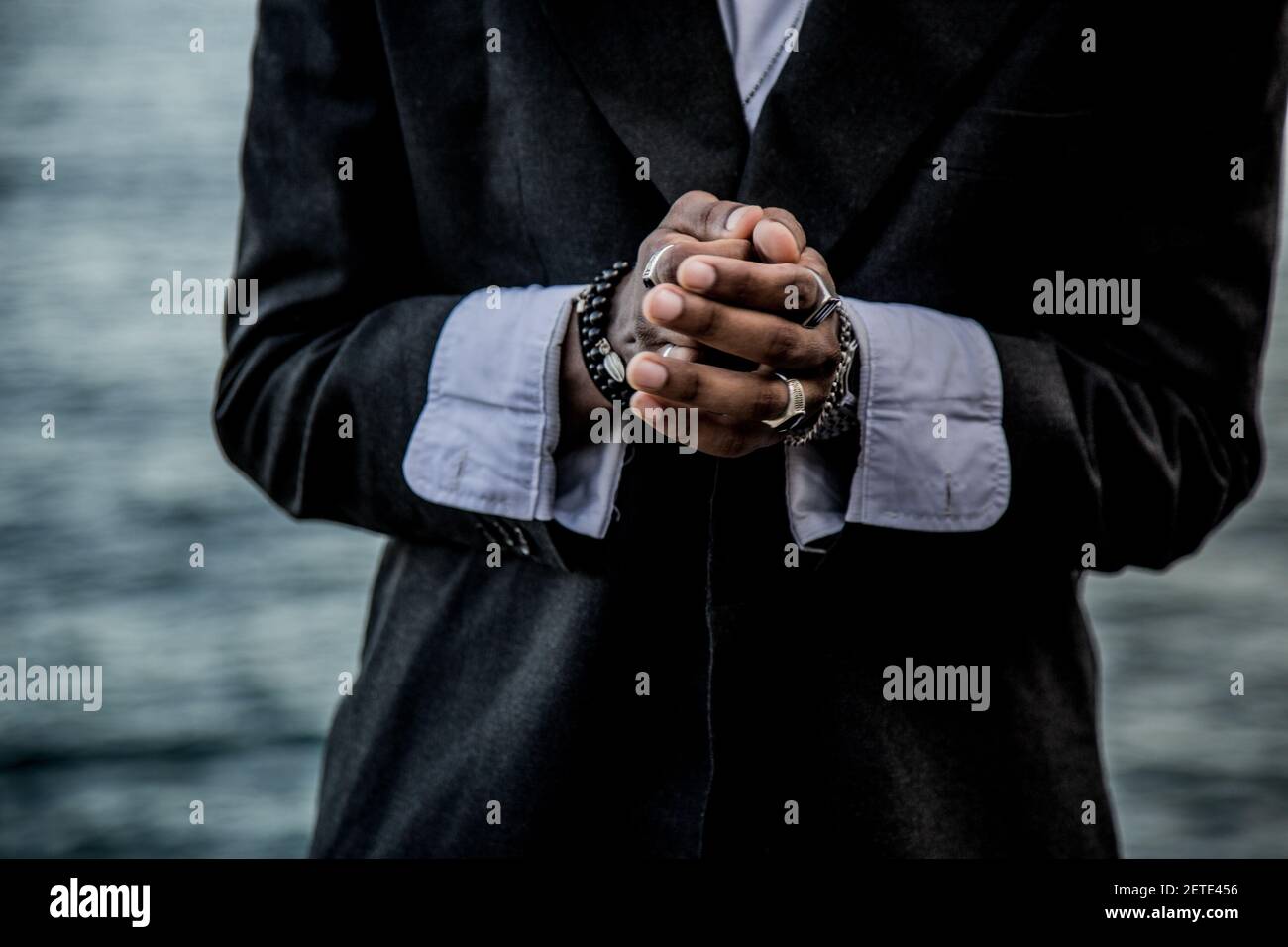 A closeup of a male's clasped hands as a form of praying Stock Photo ...