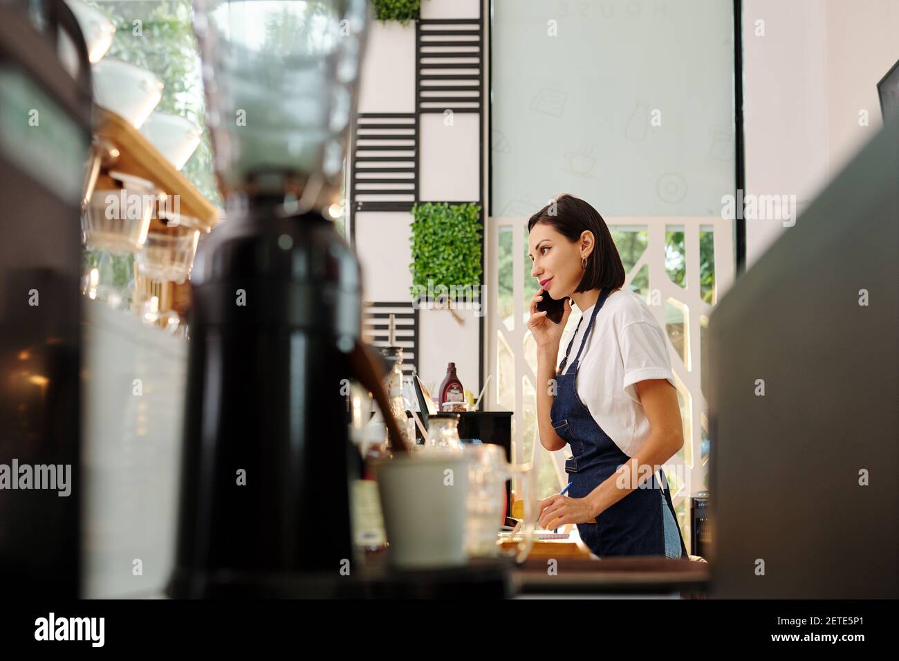 Restaurant customer calling waiter hi-res stock photography and images ...