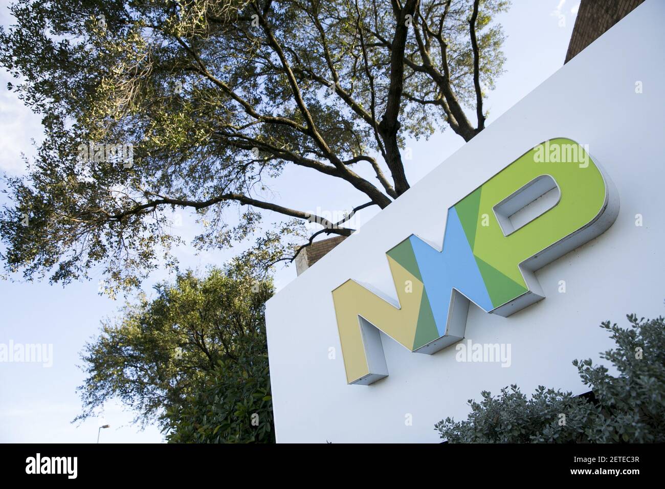 A logo sign outside of a facility occupied by NXP Semiconductors in ...