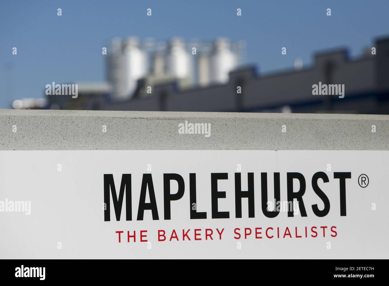 A logo sign outside of a facility occupied by Maplehurst Bakeries in ...