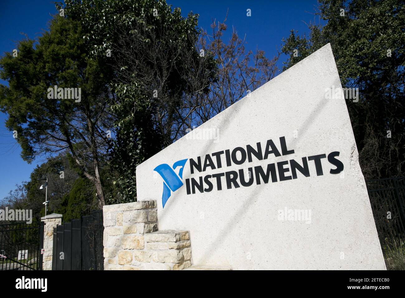 A logo sign outside of the headquarters of the National Instruments ...