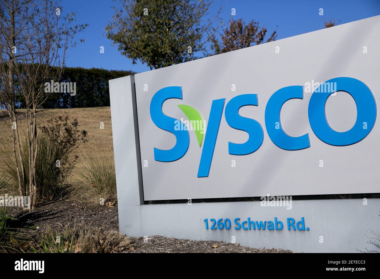 A logo sign outside of a facility occupied by the Sysco Corporation in ...