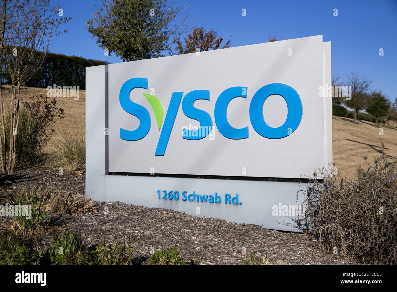 A logo sign outside of a facility occupied by the Sysco Corporation in ...