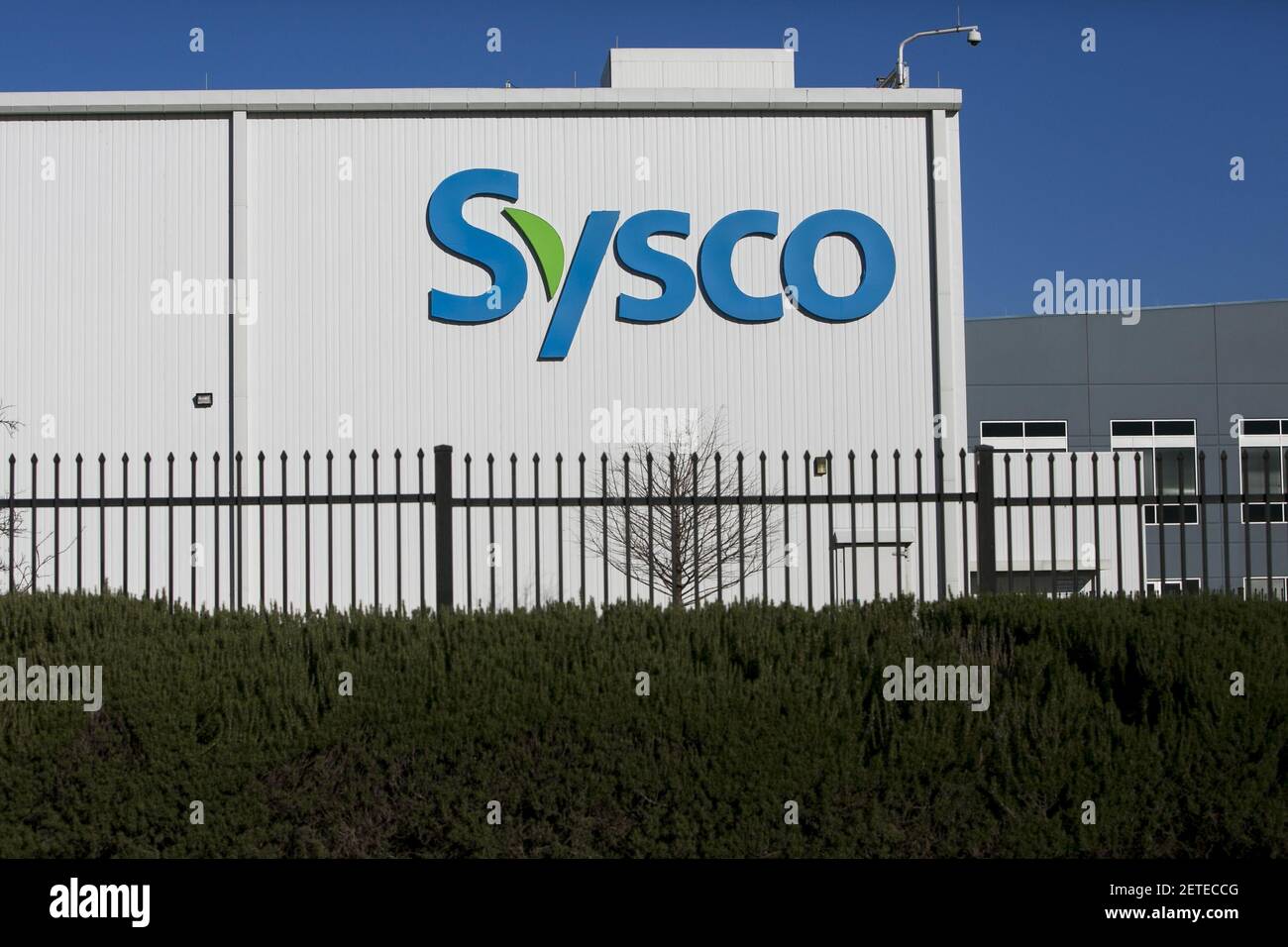 A logo sign outside of a facility occupied by the Sysco Corporation in ...