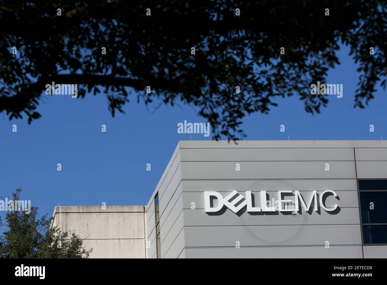 A logo sign outside of a facility occupied by Dell EMC in Round Rock ...