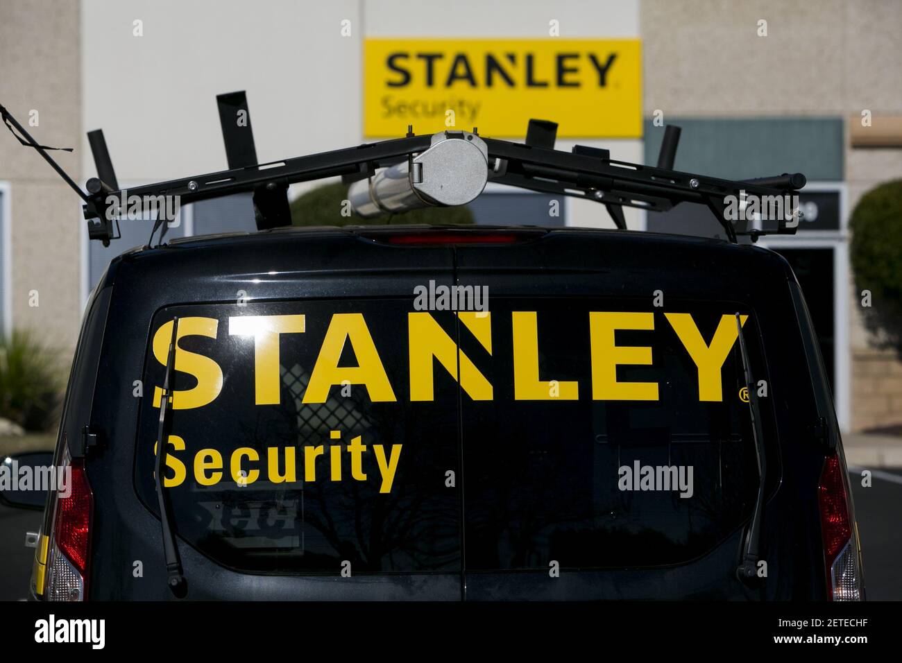 A logo sign outside of a facility occupied by Stanley Security in ...
