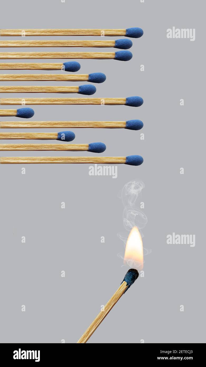 Wooden matches are lined up and a match is about to start all the ...