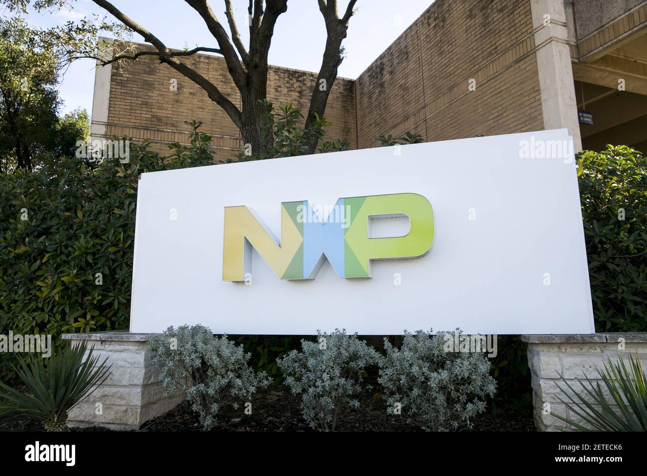 A logo sign outside of a facility occupied by NXP Semiconductors in ...