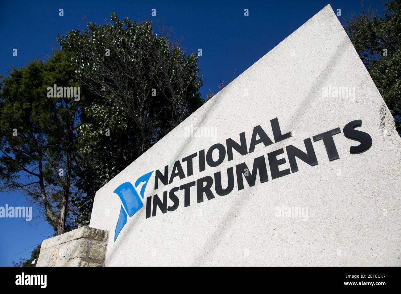 A logo sign outside of the headquarters of the National Instruments ...