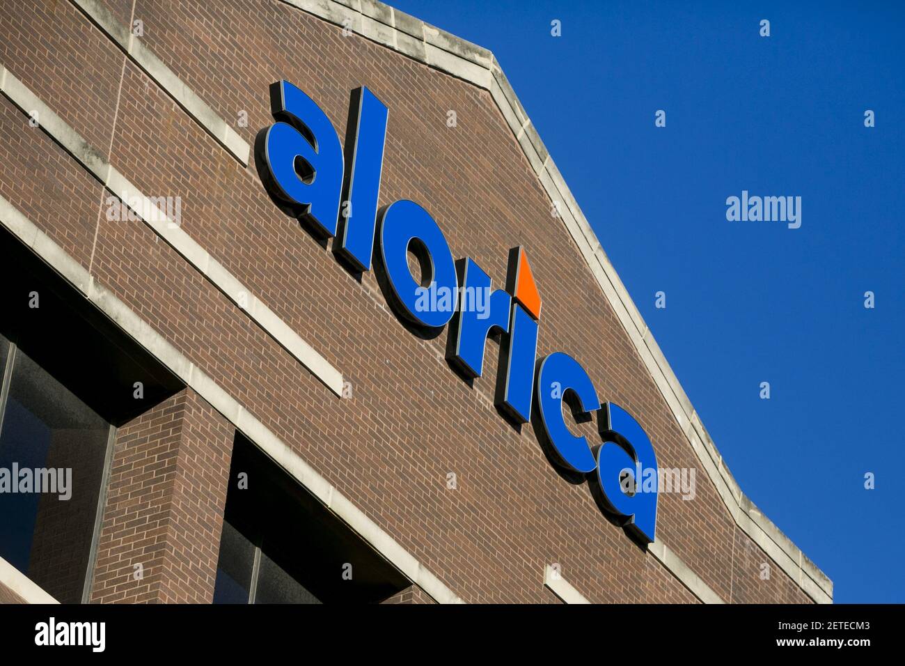 A logo sign outside of a facility occupied by Alorica in San Antonio ...