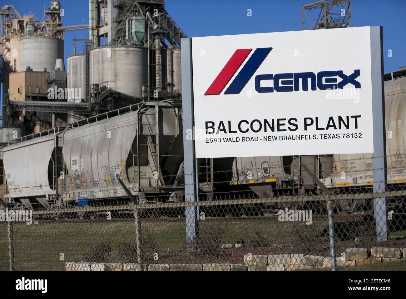 A logo sign outside of a facility occupied by Cemex in New Braunfels ...