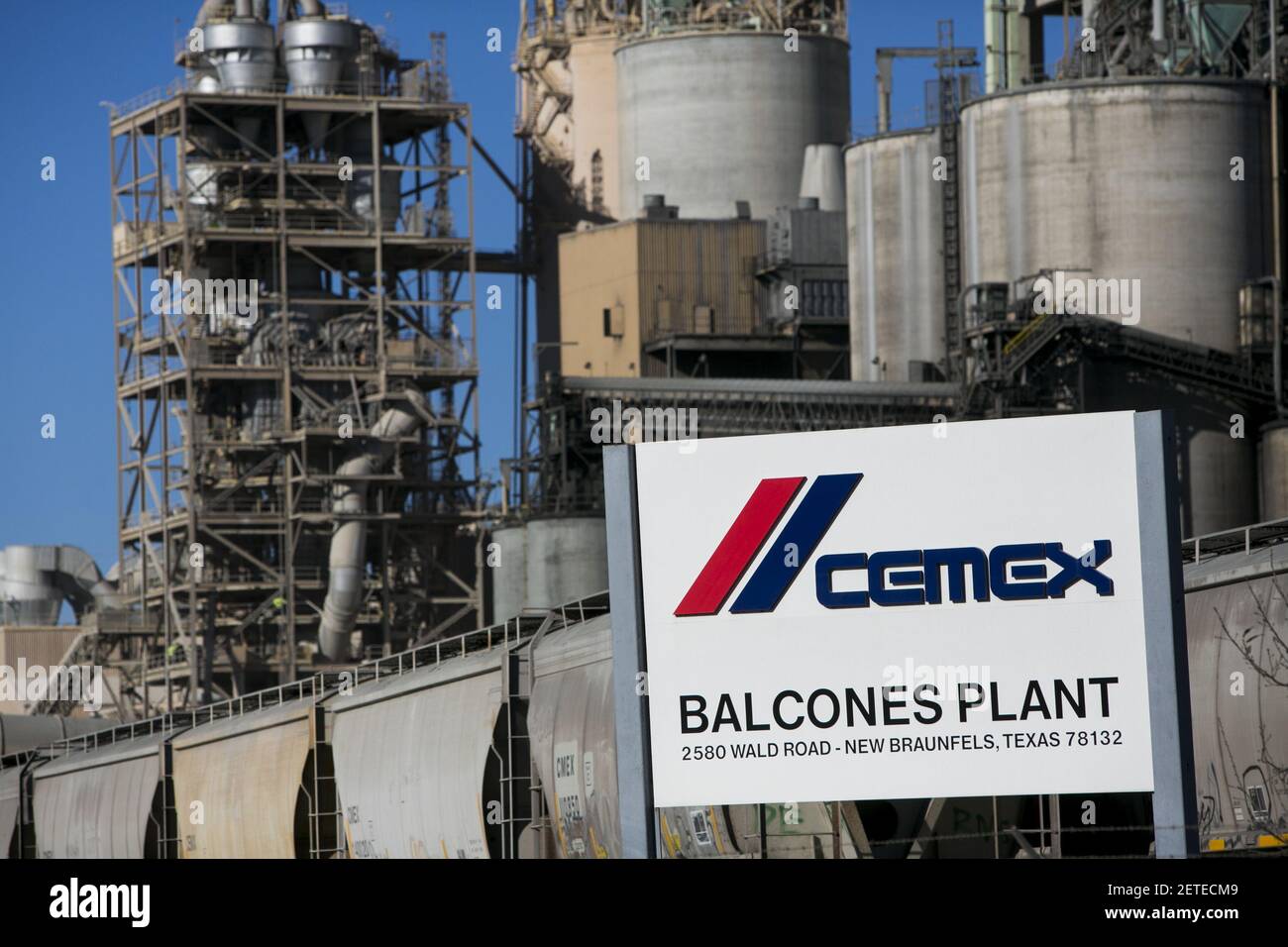 A logo sign outside of a facility occupied by Cemex in New Braunfels ...